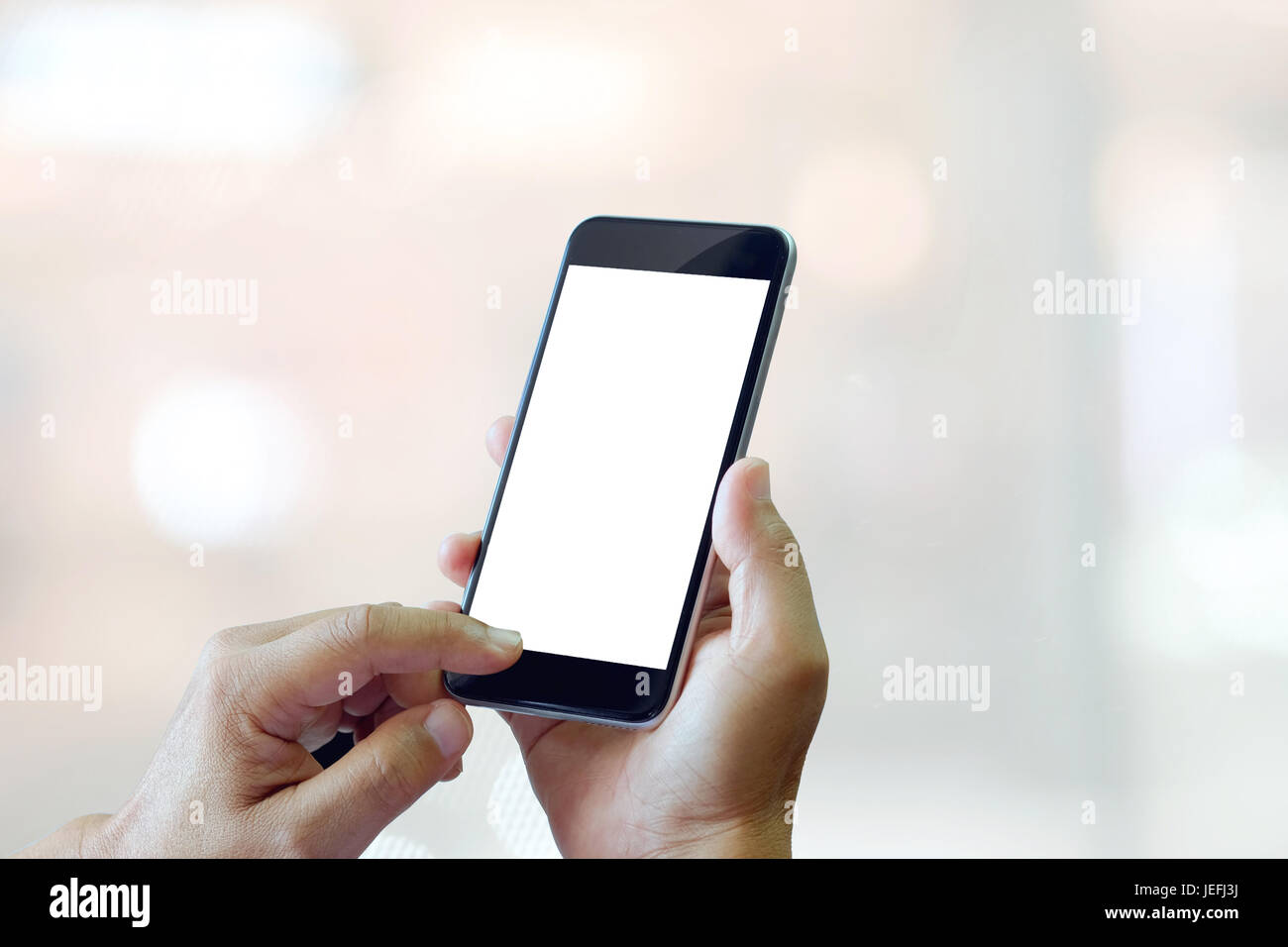 Man using smartphone on blur background. Blank screen smartphone for ...