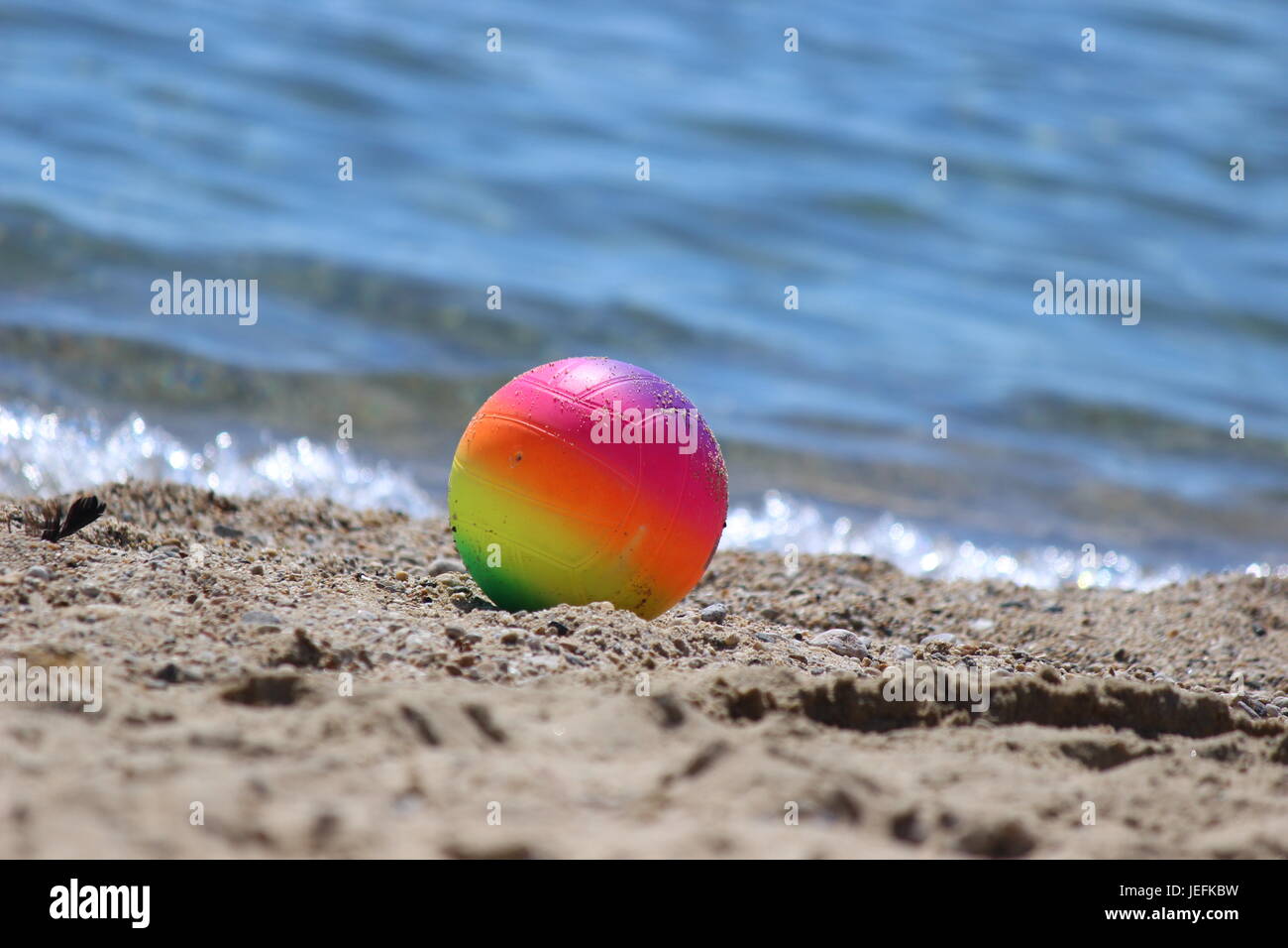 Colorful ball on the beach Stock Photo - Alamy