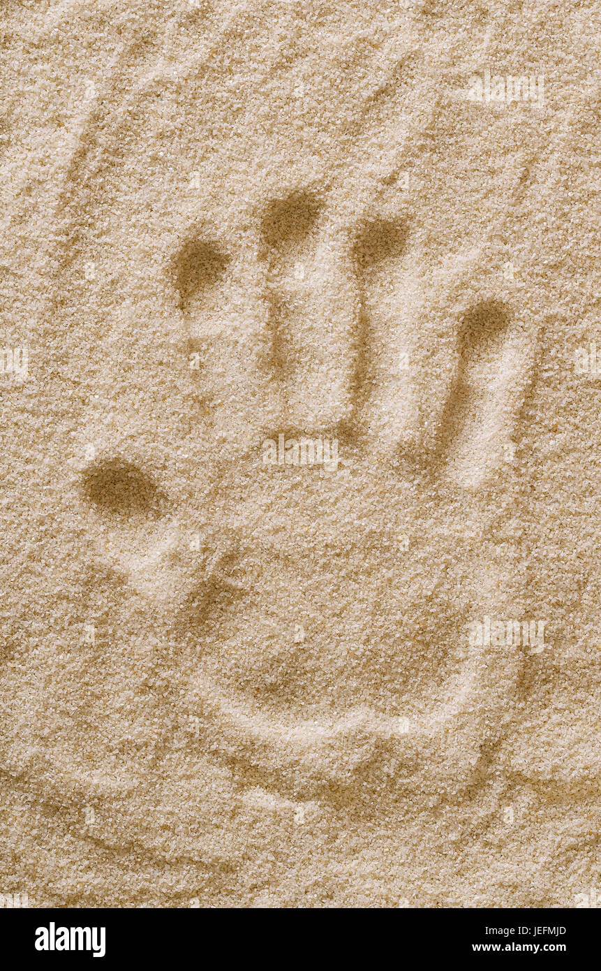 Handprint in the sand. Handmark and imprint of the left hand of an ...