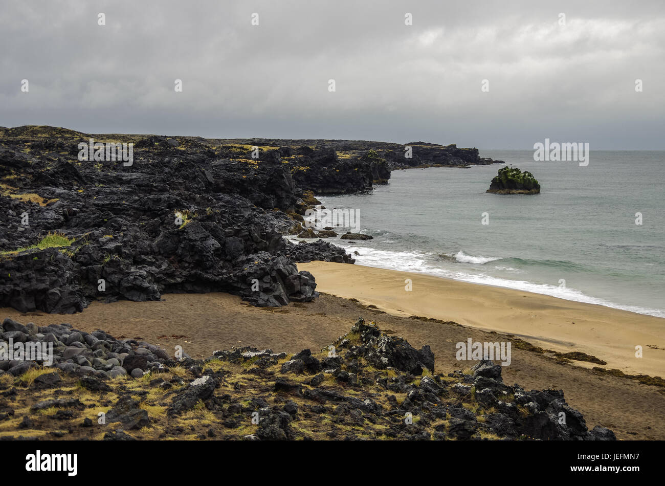 Atlantic ocean and black rock cliff of western Iceland coast ...
