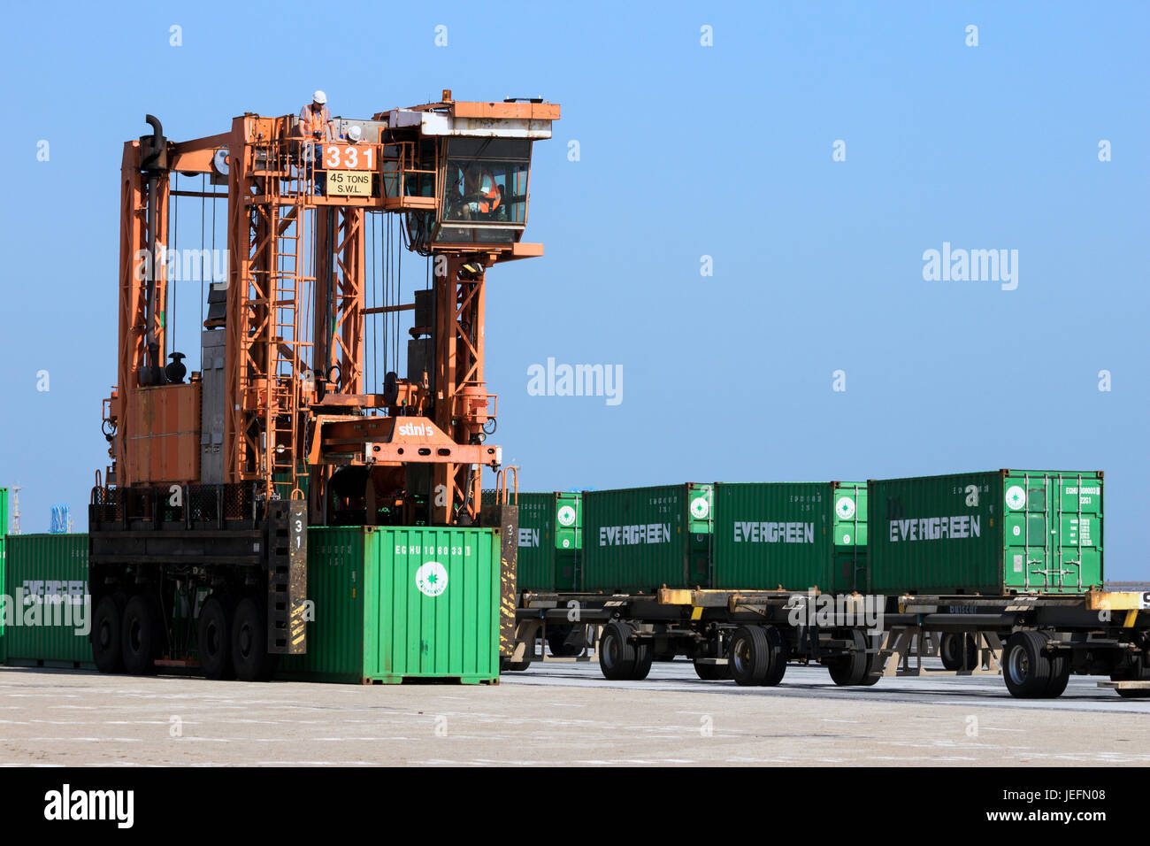 Straddle carrier moving container hi-res stock photography and images ...