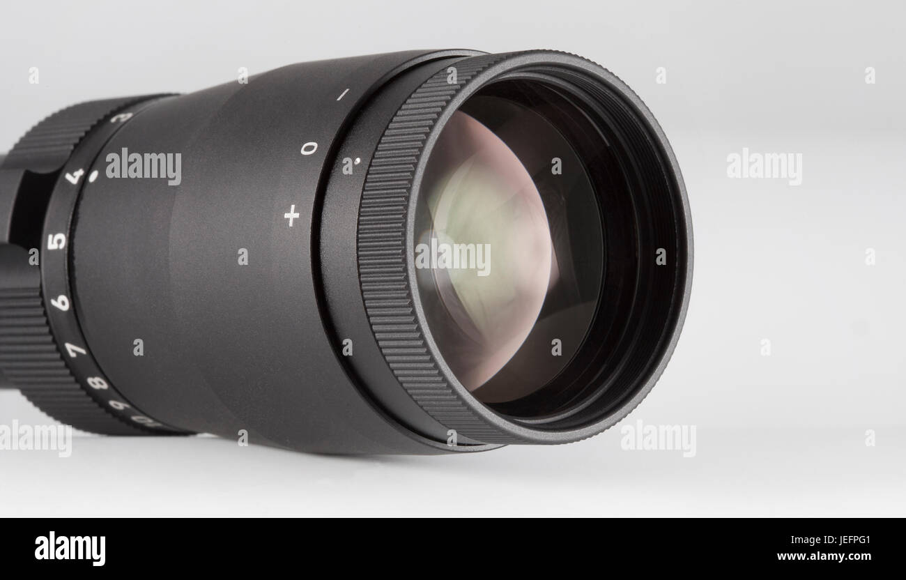 Rear lens on a riflescope on a white background Stock Photo - Alamy