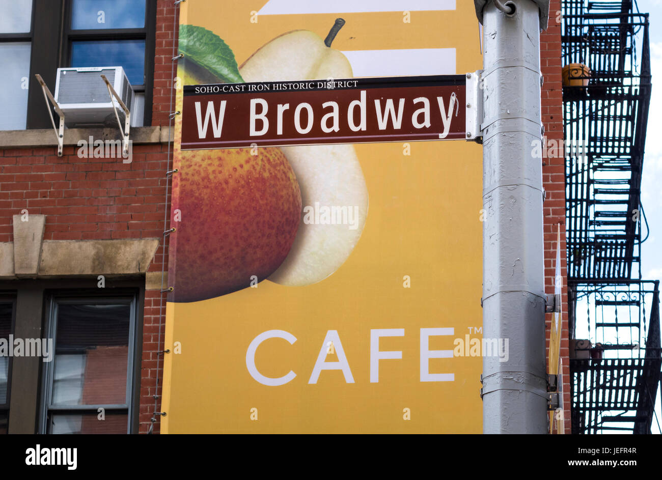 A brown street sign for West Broadway in SoHo in Lower Manhattan in New ...