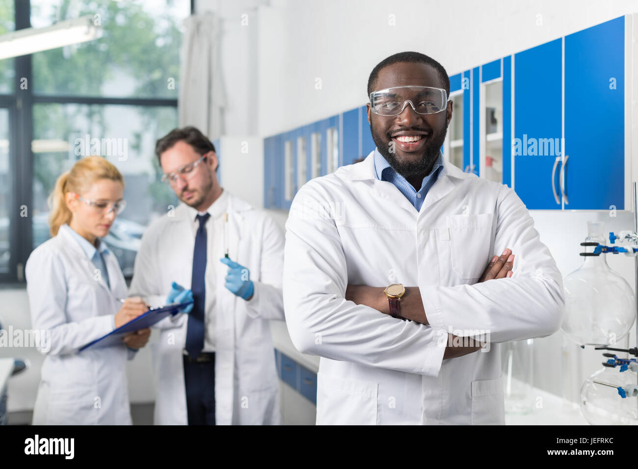 Happy Smiling African American Scientist Stand In Front Of Colleagues ...