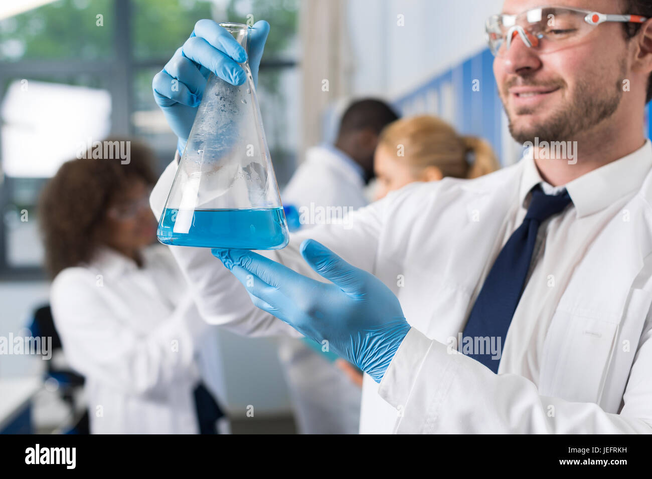 Male Scientist Working With Flask In Laboratory Making Research Over ...