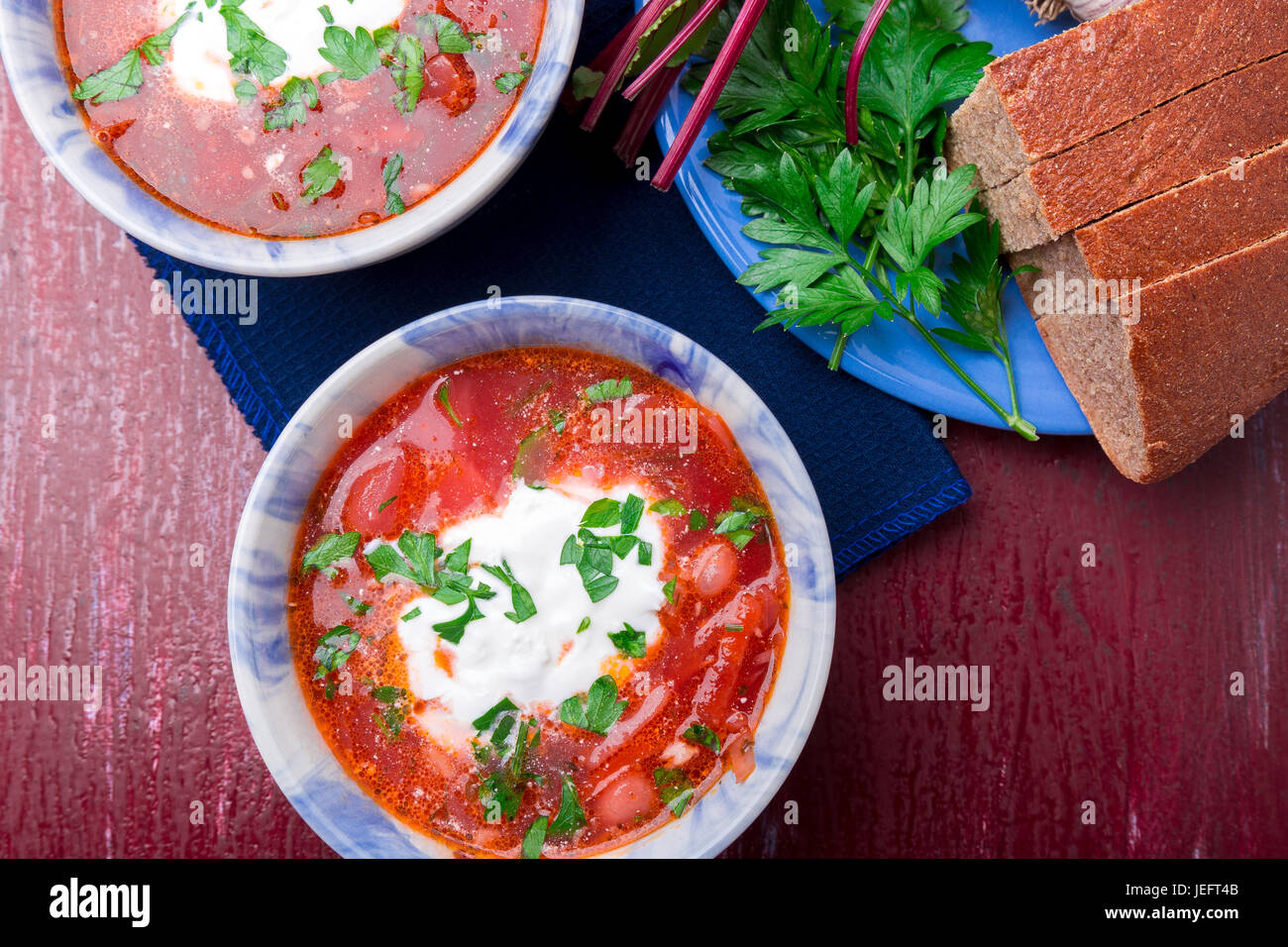 Ukrainian traditional borsch. Russian vegetarian red soup in blue bowl ...