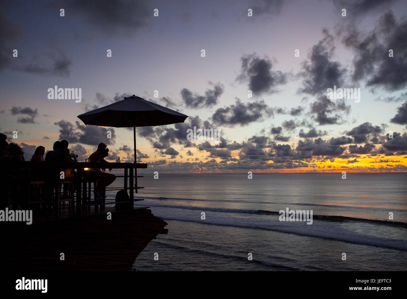 Silhouette of people at bar sunset background Stock Photo - Alamy