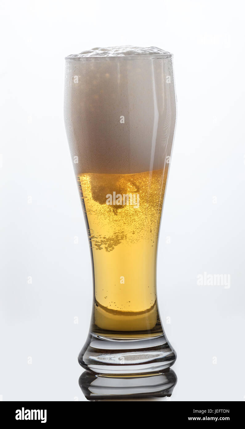 Glass of light beer on white background Stock Photo - Alamy