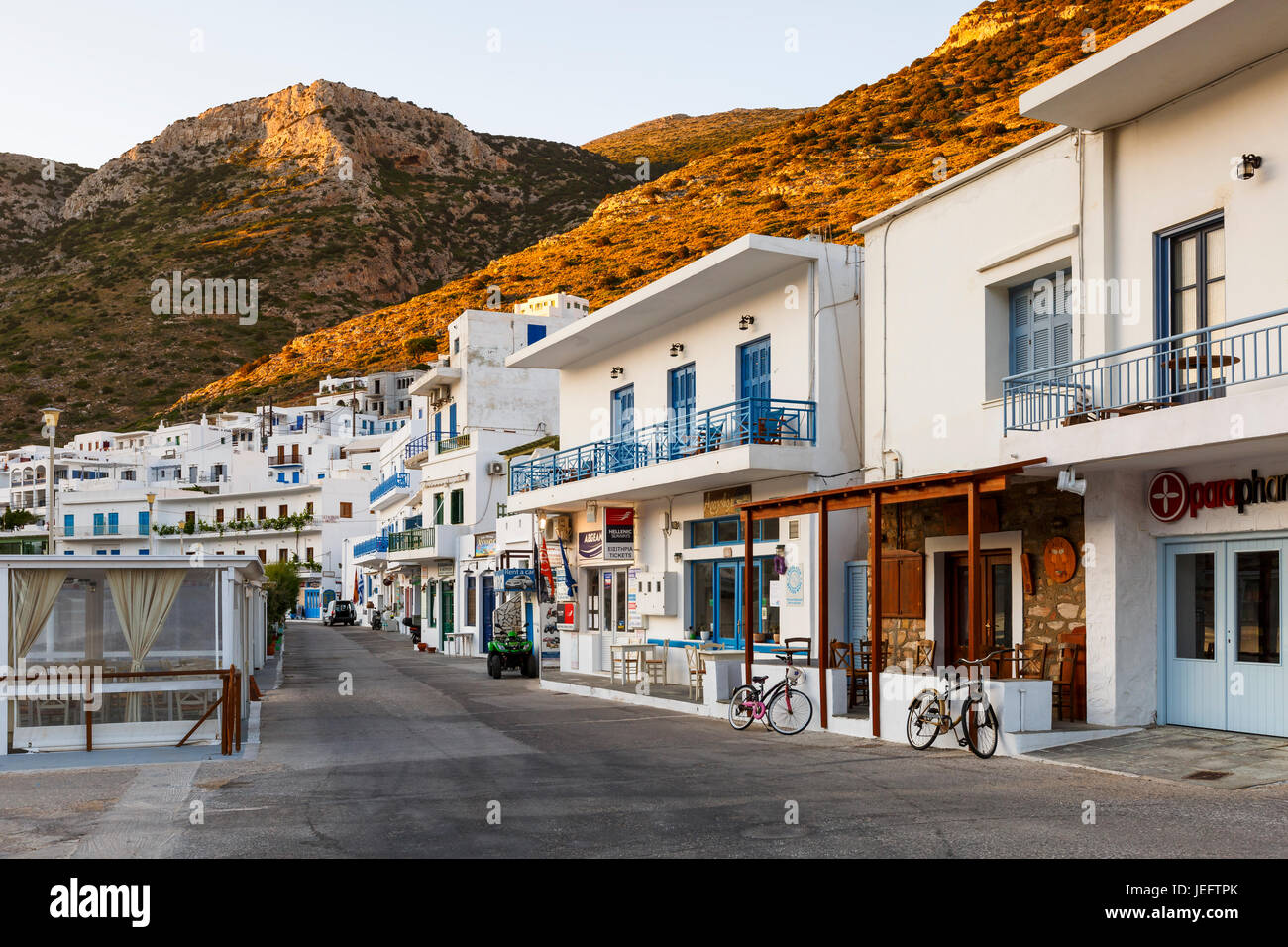 Main street of the port of Kamares on Sifnos island, Greece Stock Photo ...