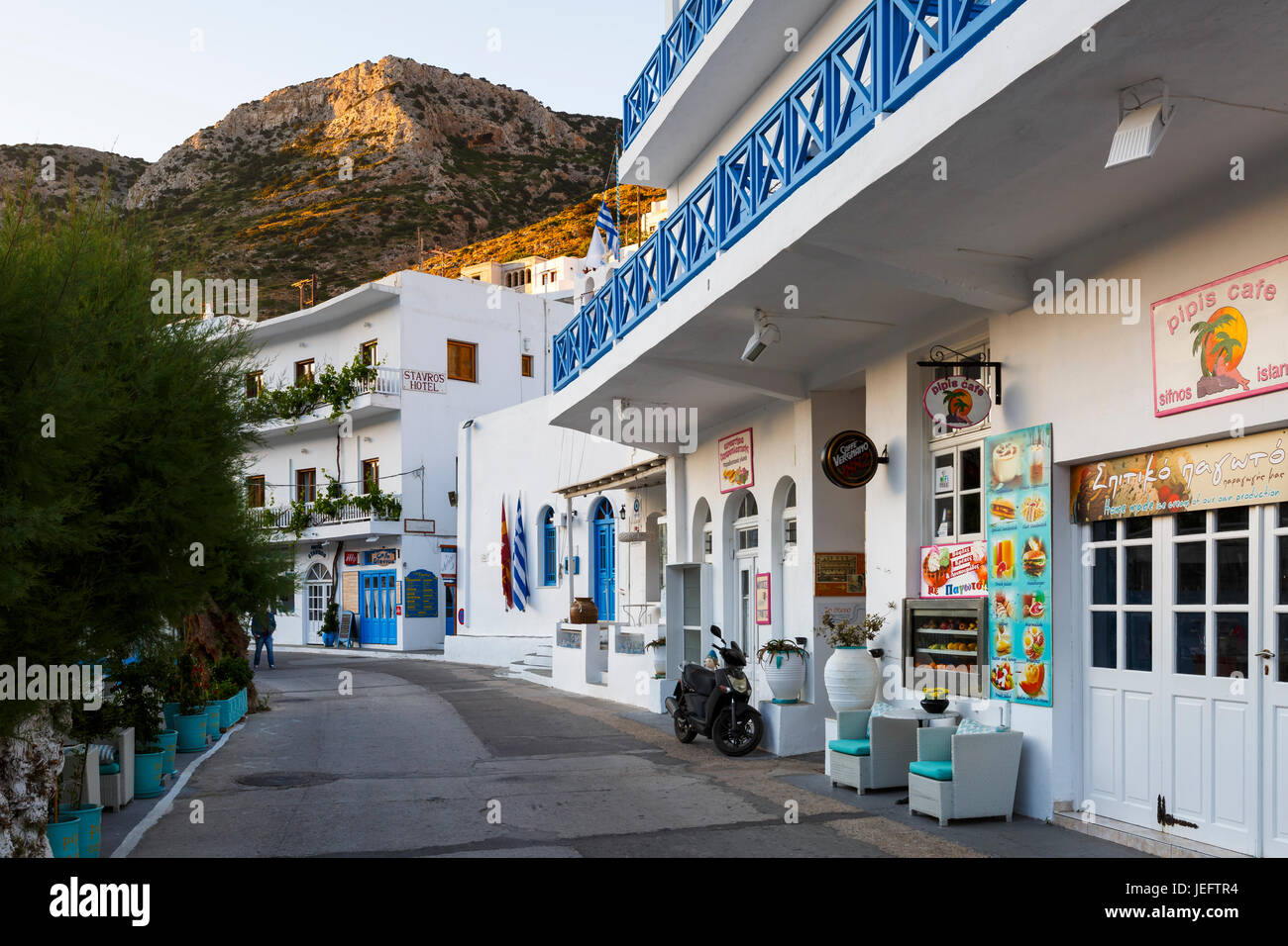 Main street of the port of Kamares on Sifnos island, Greece Stock Photo ...