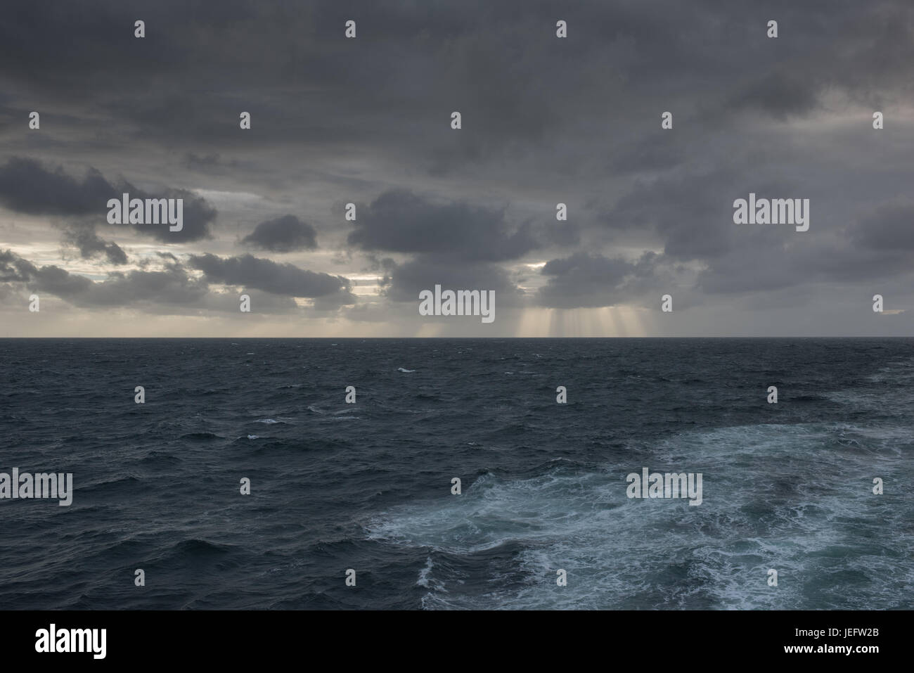 Germany, rain clouds over water Stock Photo - Alamy