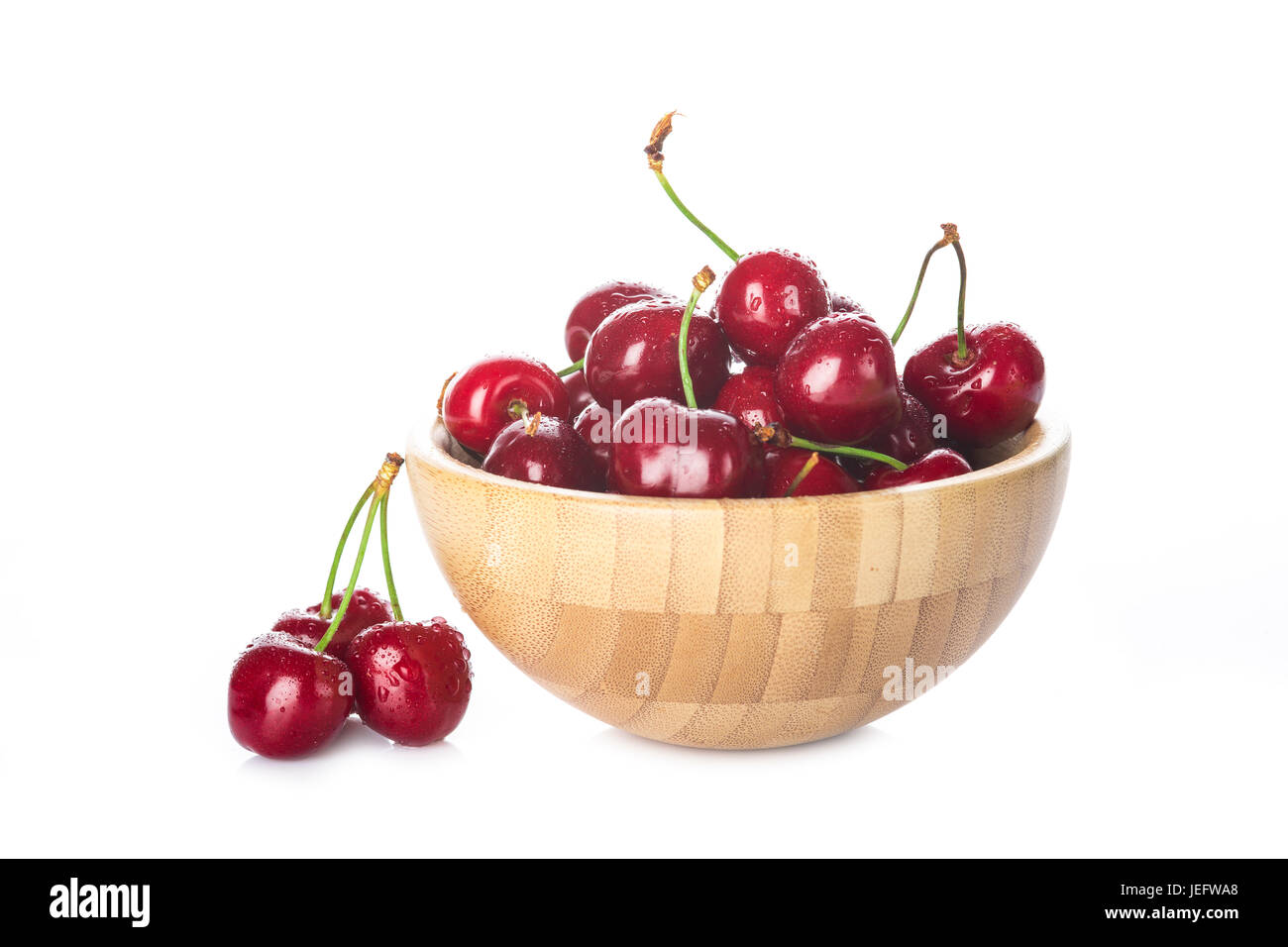 Wooden bowl with fresh cherries isolated on a white background Stock ...