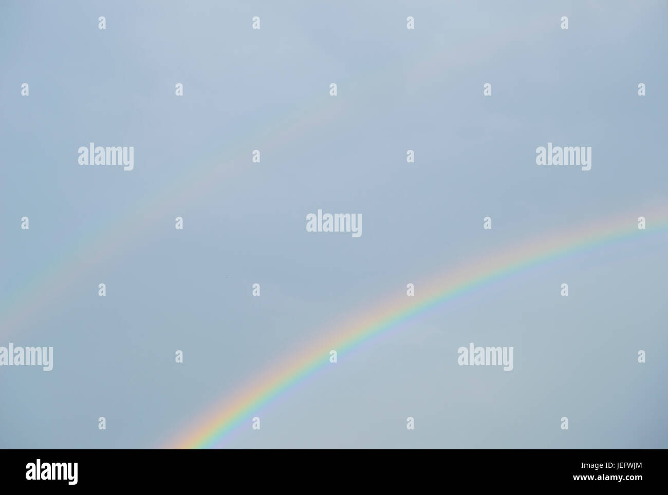 Two rainbow on the sky after the rain Stock Photo - Alamy