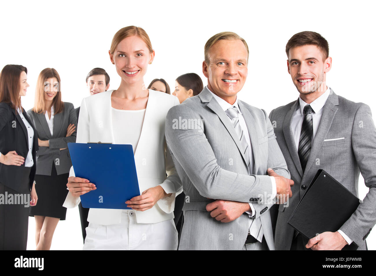 Smiling business leaders and their team isolated on white background ...