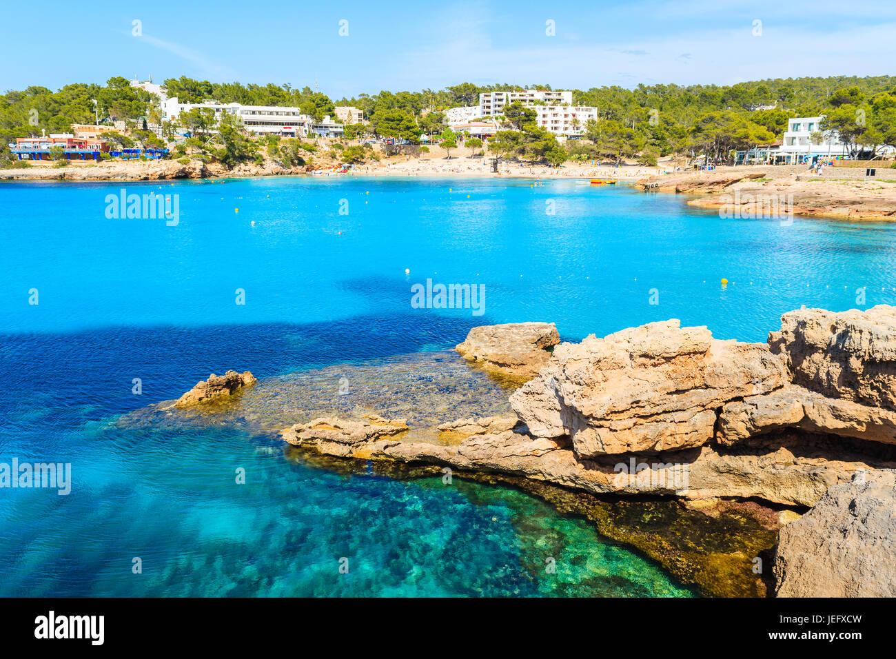 Sea cove in Cala Portinatx bay with azure blue sea water, Ibiza island ...