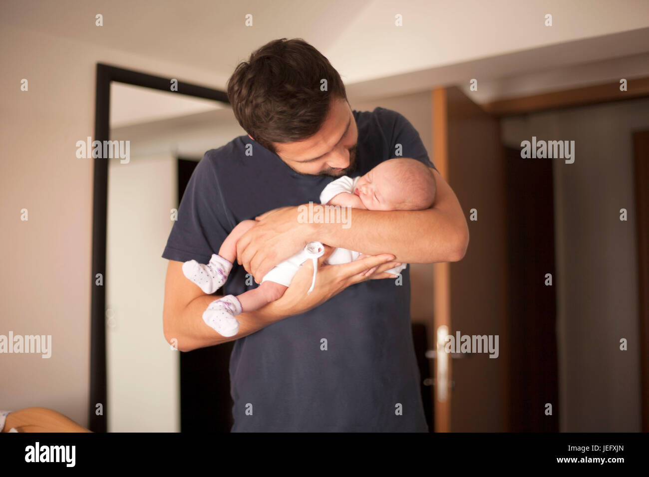 Baby sleeping in father arms hi-res stock photography and images - Alamy