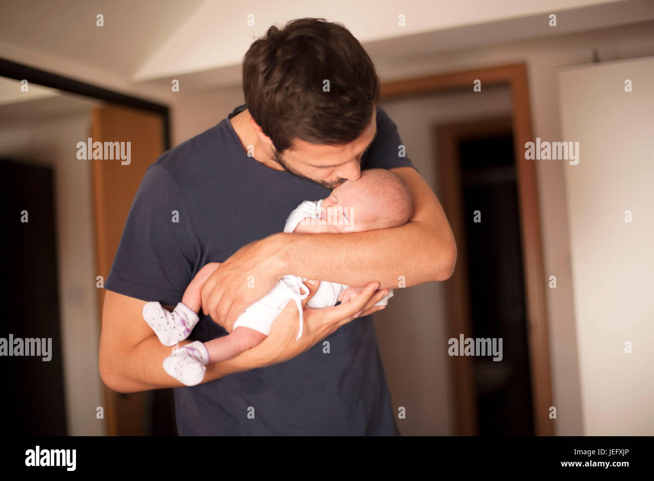 Baby sleeping in father arms hi-res stock photography and images - Alamy