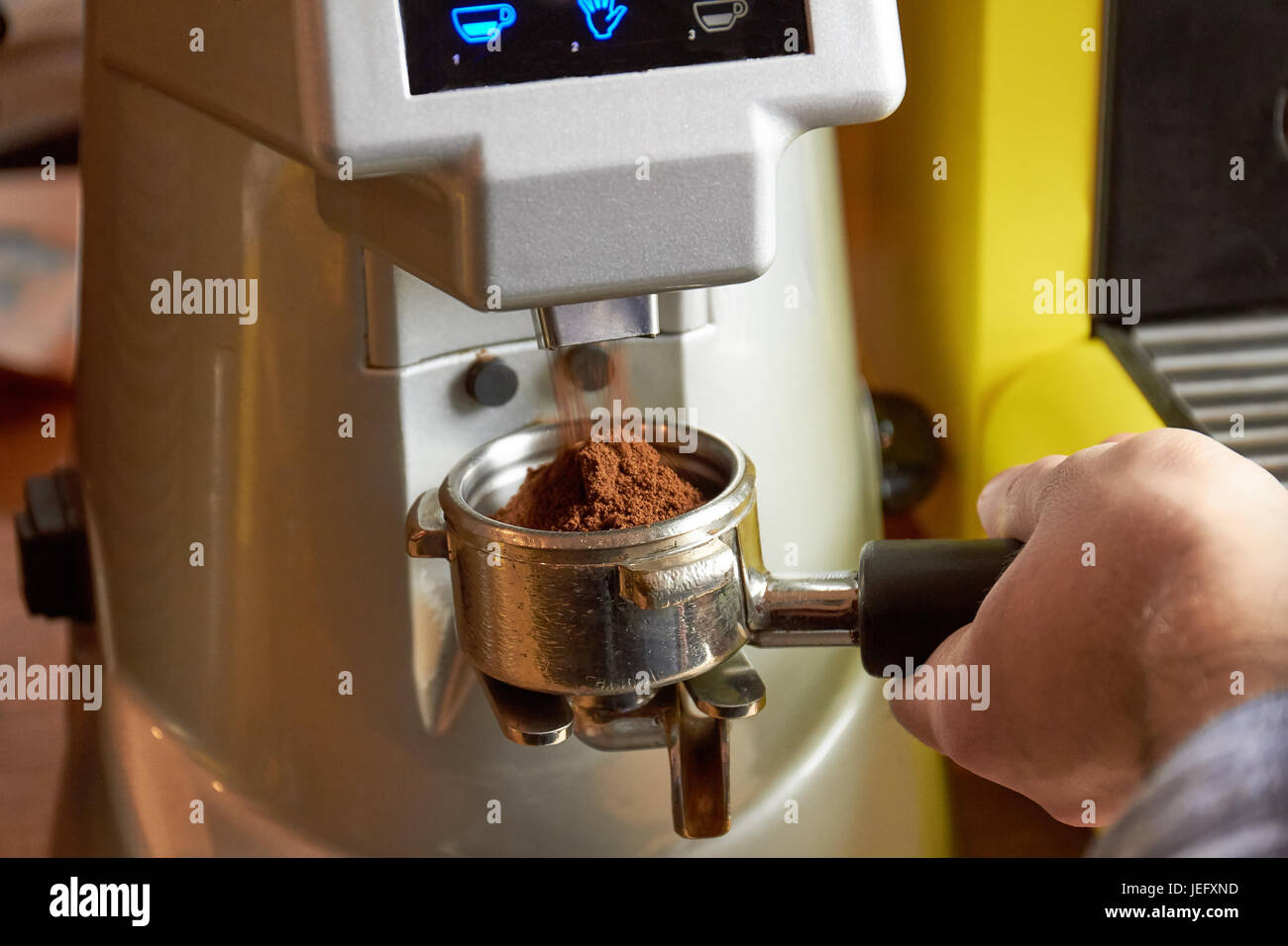 Male hand and coffee machine Stock Photo - Alamy
