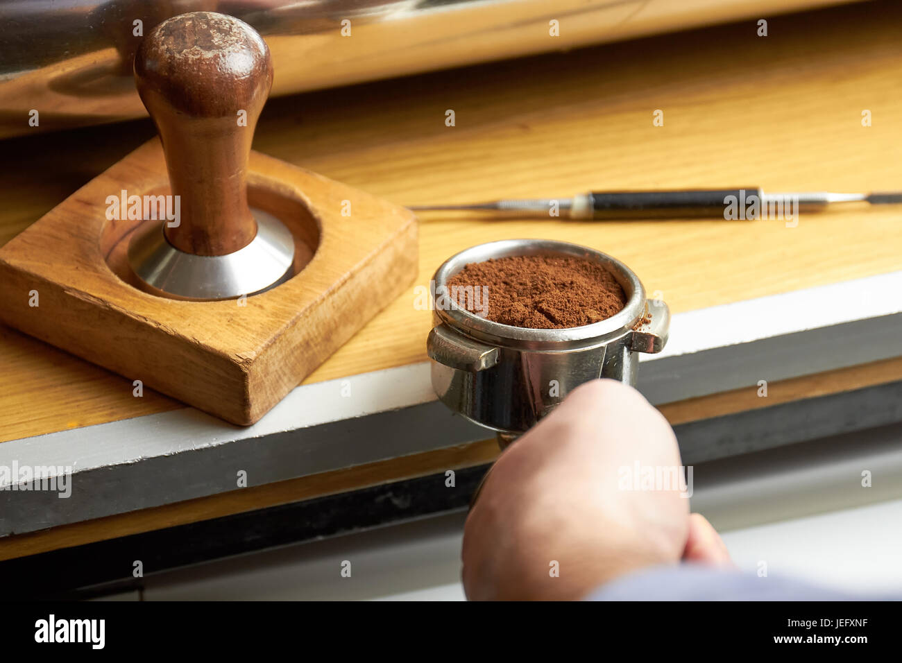 Portafilter with ground coffee Stock Photo - Alamy