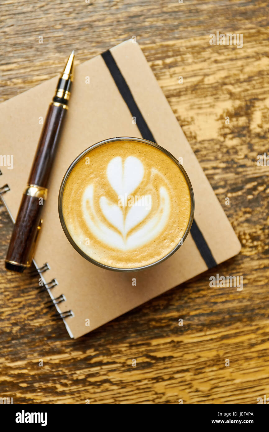 Coffee, pen and notebook Stock Photo - Alamy