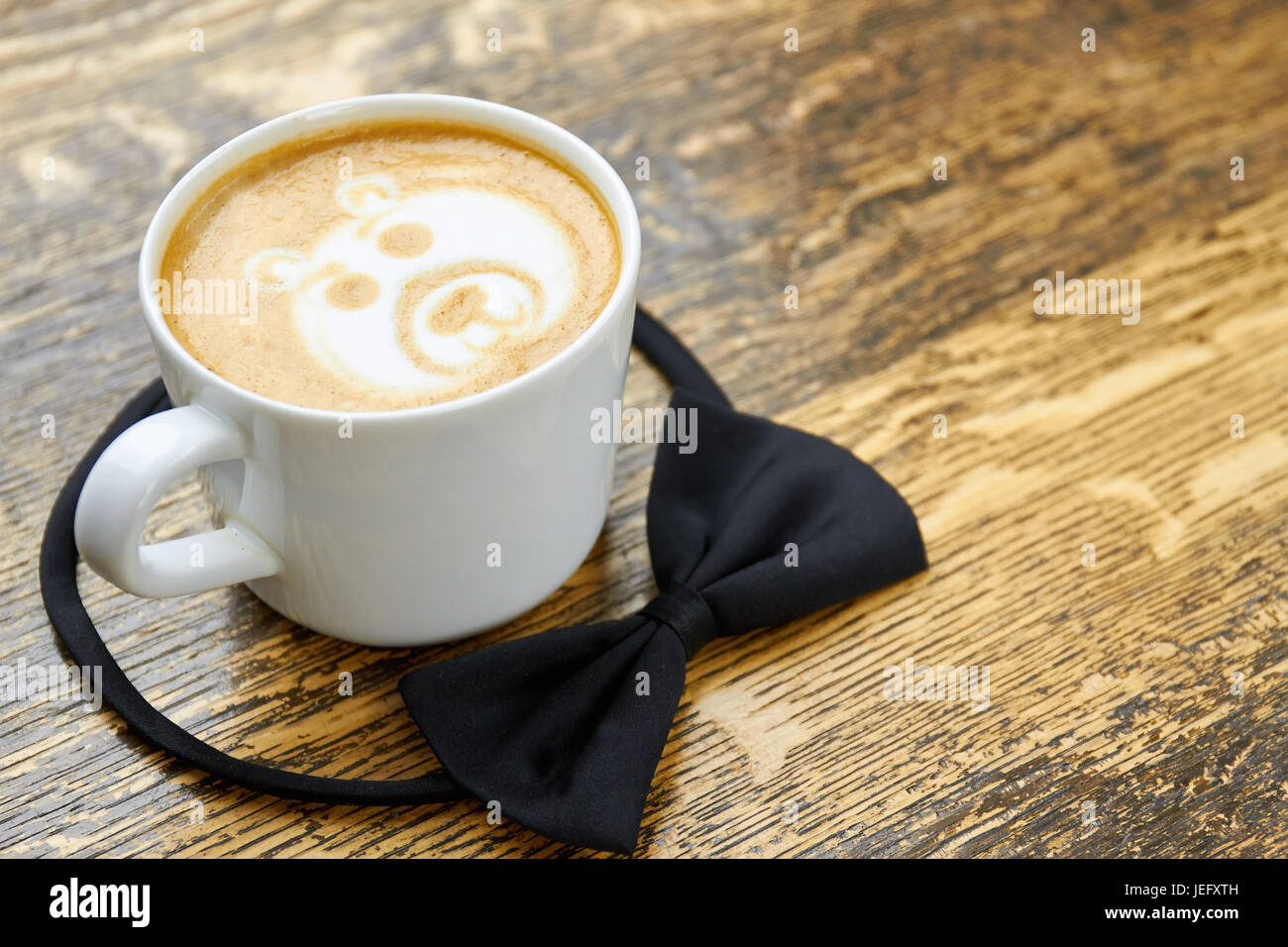 Bow tie and coffee cup Stock Photo - Alamy