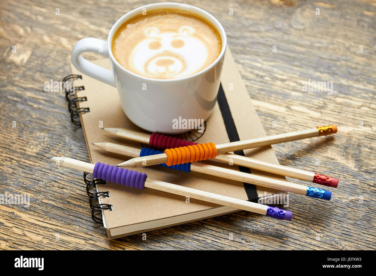 Coffee, notebook and pencils Stock Photo - Alamy