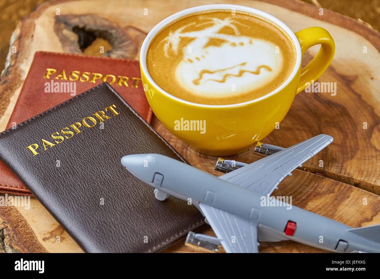 Passports, coffee and toy airplane Stock Photo - Alamy