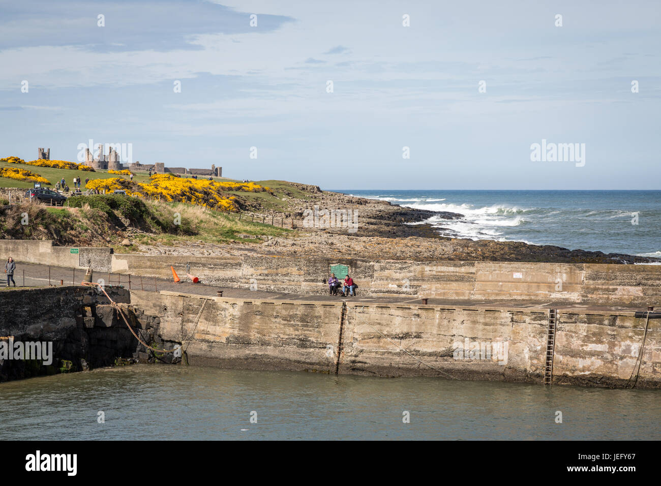 View of Dunstanburgh Castle from Craster Harbour, Northumberland ...