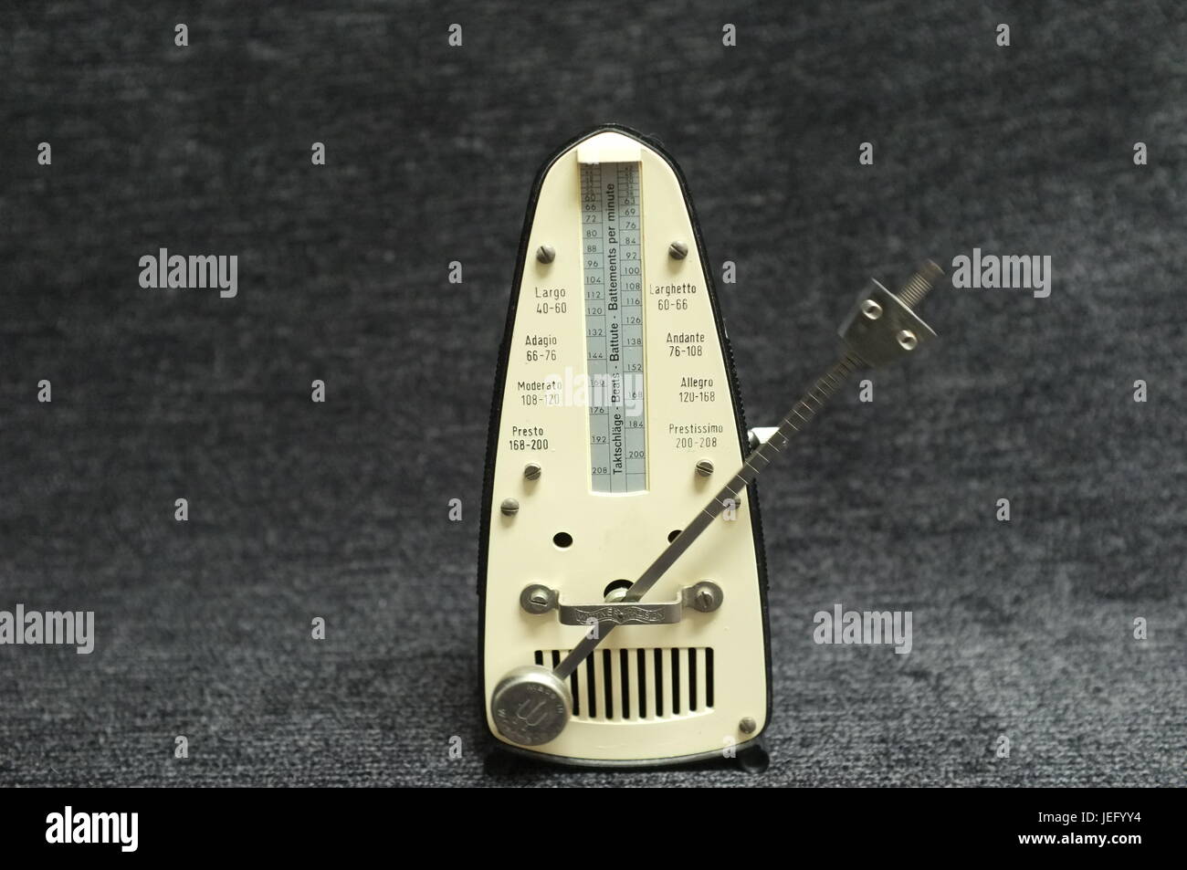 white vintage metronome Stock Photo - Alamy