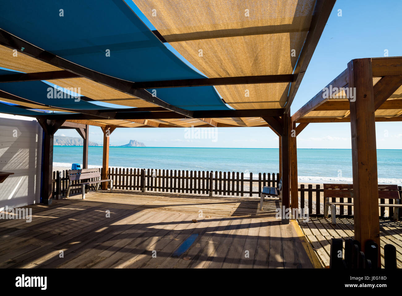 Shaded wooden terrace on a sunny Mediterranean beach Stock Photo - Alamy