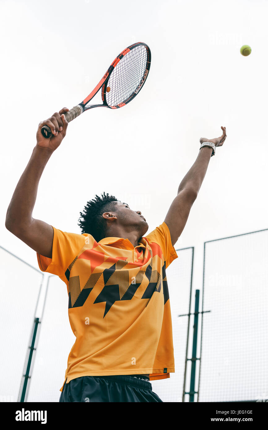 Preparing to his best serve Stock Photo - Alamy