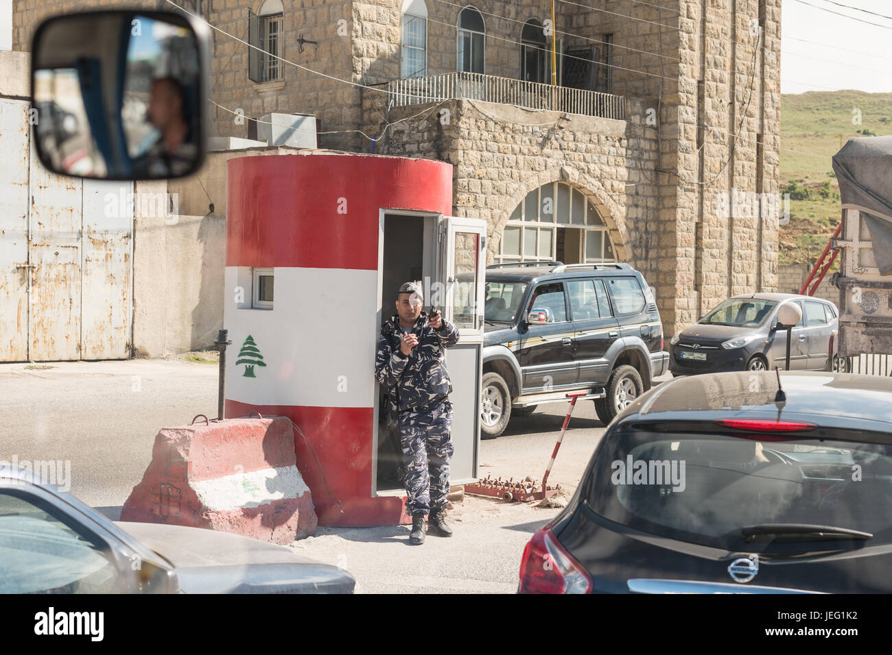 Armed guard at checkpoint going into Beirut, Lebanon, warns that photos ...