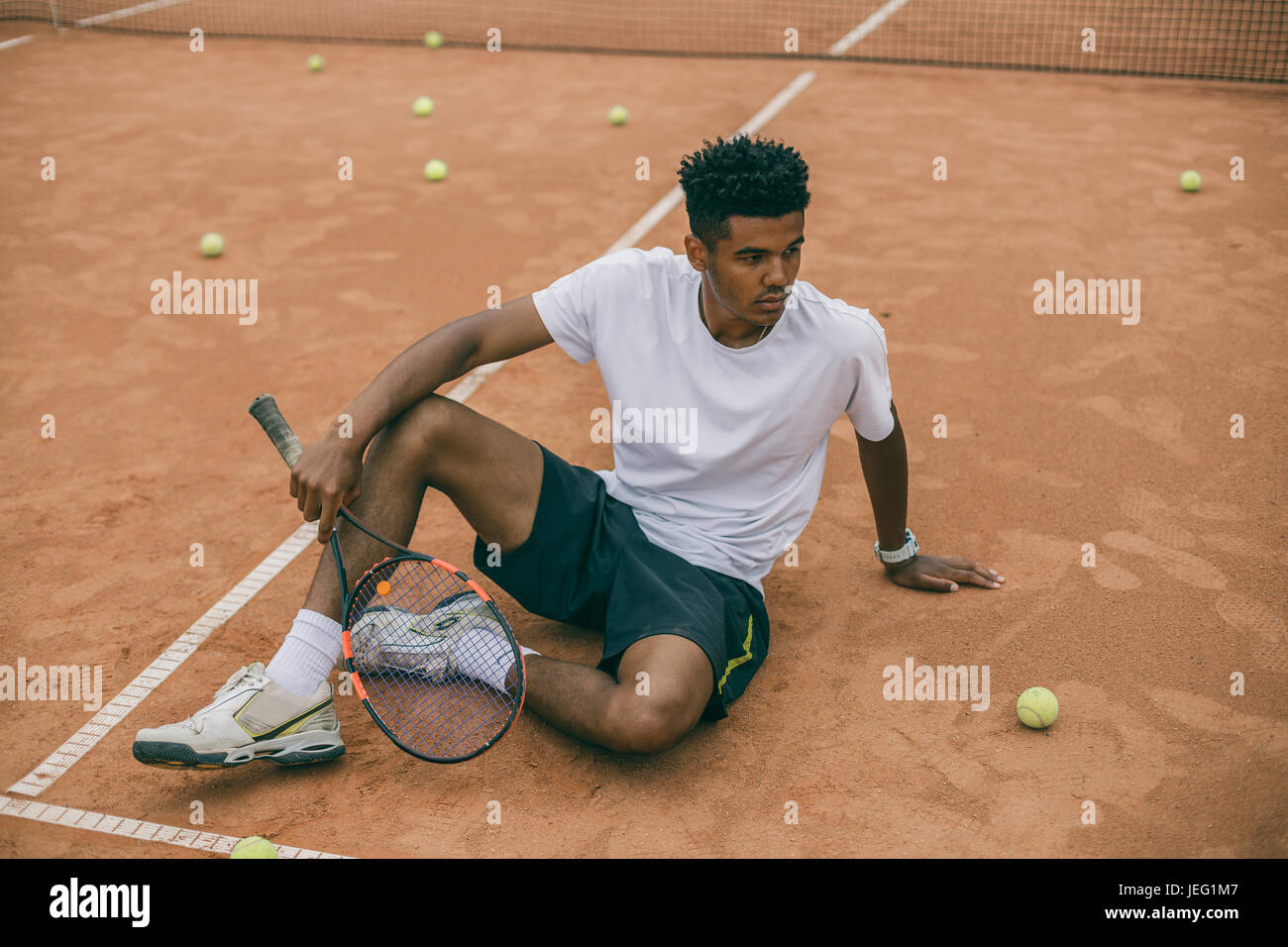 Tennis player is having a quick time break Stock Photo - Alamy