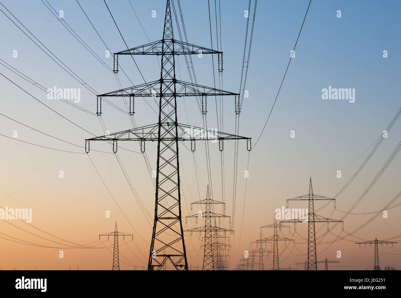 Power poles at sunset Stock Photo - Alamy