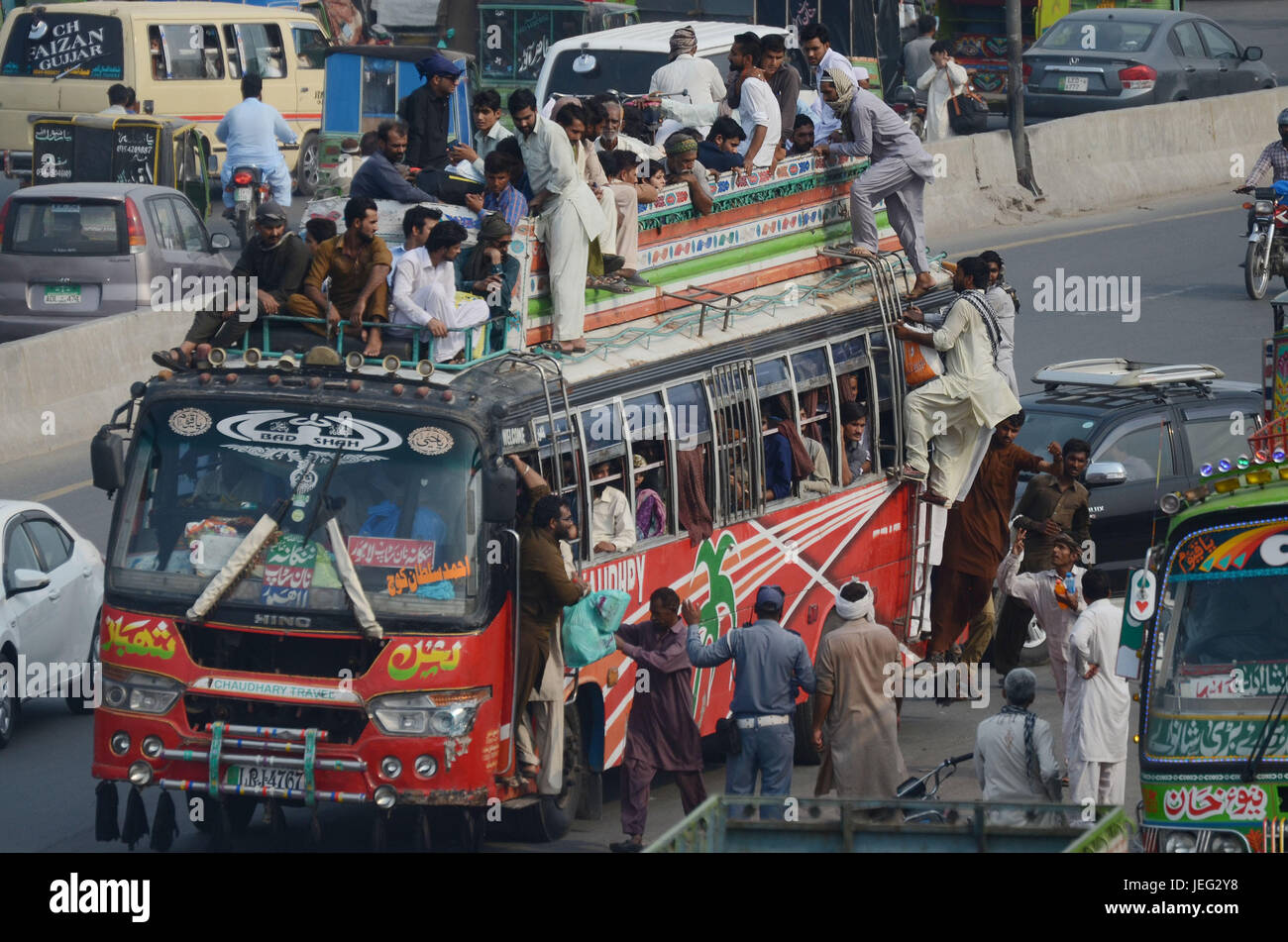 Lahore, Pakistan. 25th June, 2017. Pakistani people travel by ...