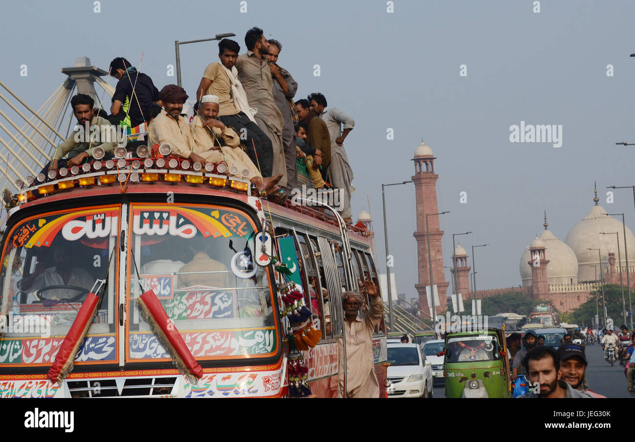 Lahore, Pakistan. 25th June, 2017. Pakistani people travel by ...
