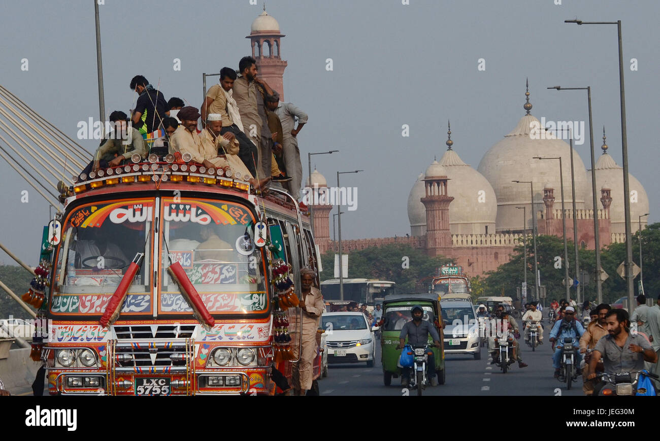 Lahore, Pakistan. 25th June, 2017. Pakistani people travel by ...