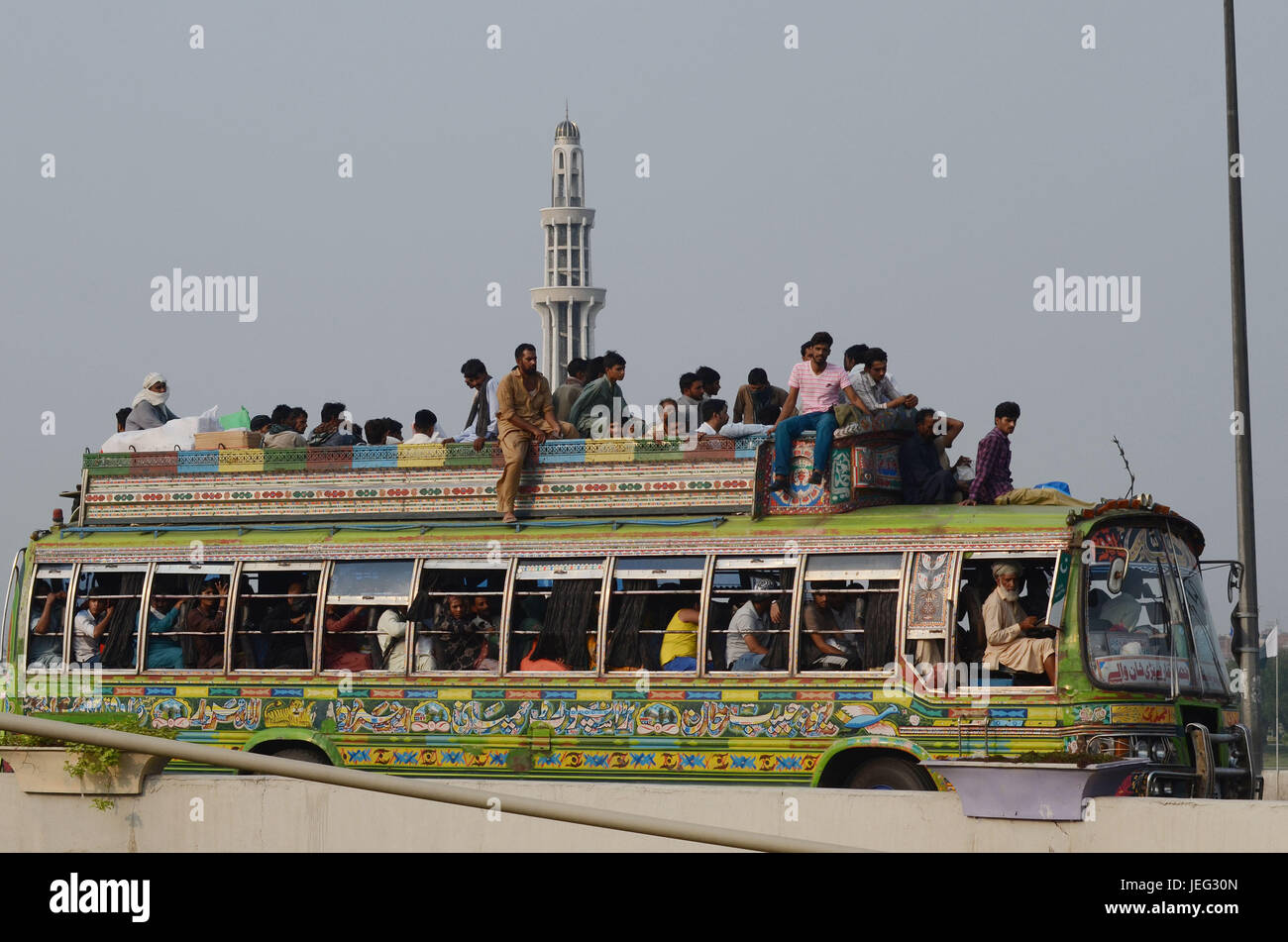 Lahore, Pakistan. 25th June, 2017. Pakistani people travel by ...
