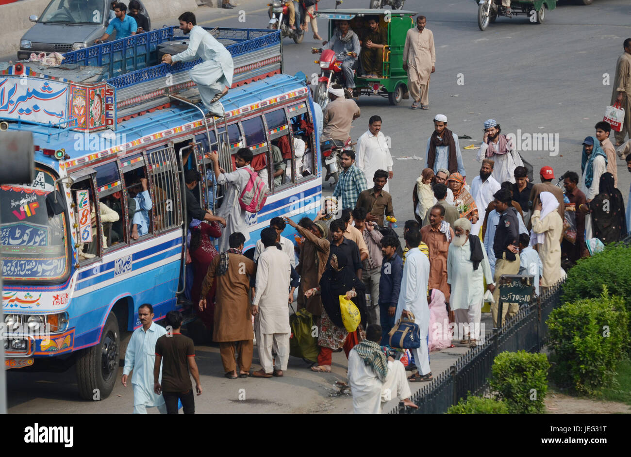 Lahore, Pakistan. 25th June, 2017. Pakistani people travel by ...