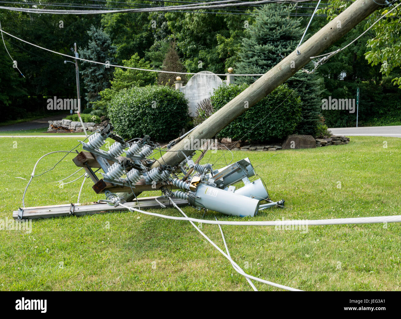 Snapped and downed power post and line after storm Stock Photo - Alamy