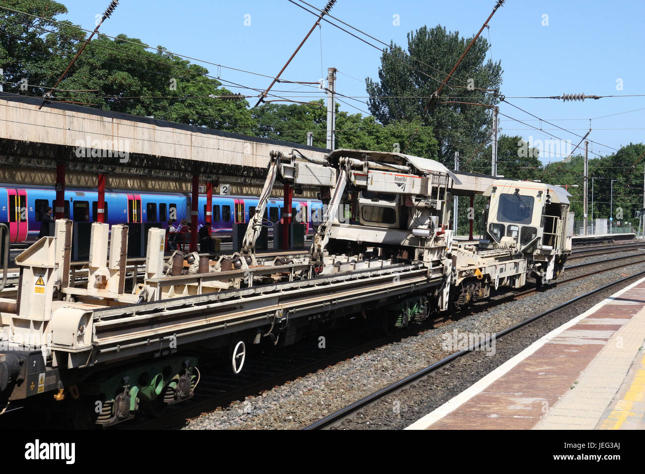 End of engineers freight train carrying rail passing through Lancaster ...