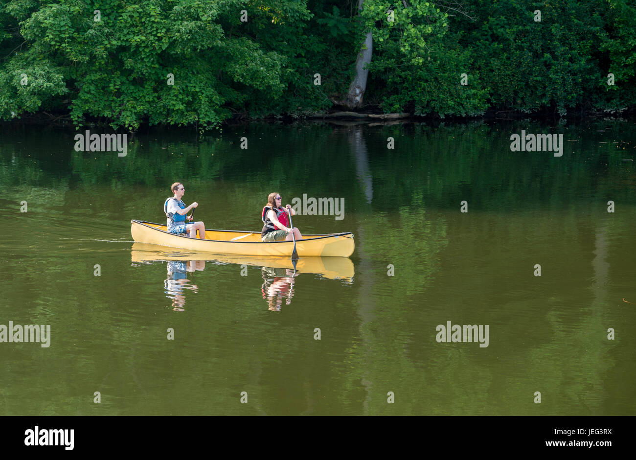 Couple in yellow canoe hi-res stock photography and images - Alamy