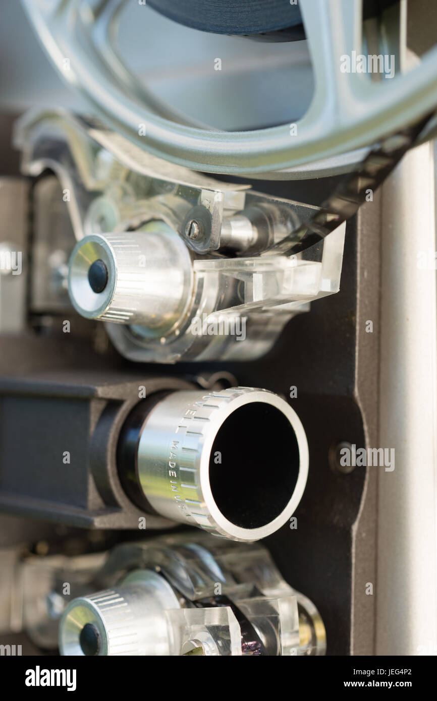 A large film reel is mounted on a vintage Super 8 movie projector Stock ...