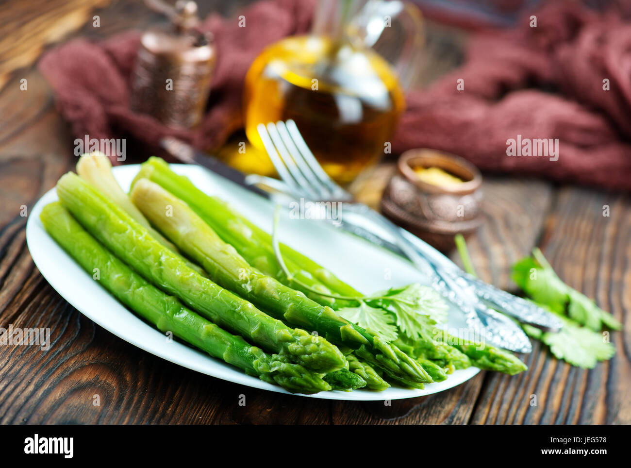fried asparagus on plate and on a table Stock Photo - Alamy