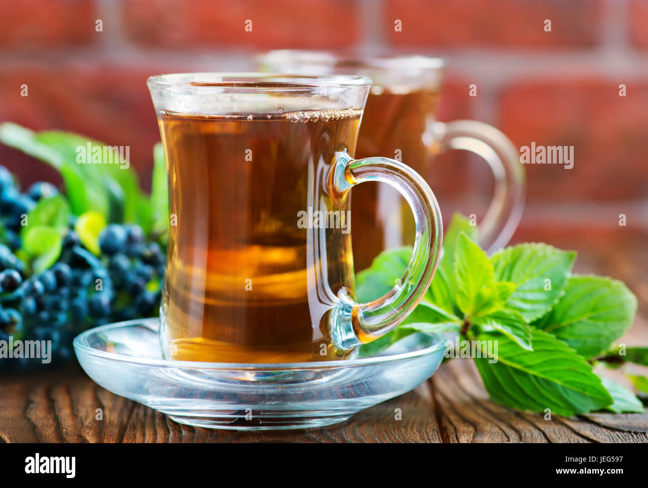 blueberry tea in cup and on a table Stock Photo - Alamy