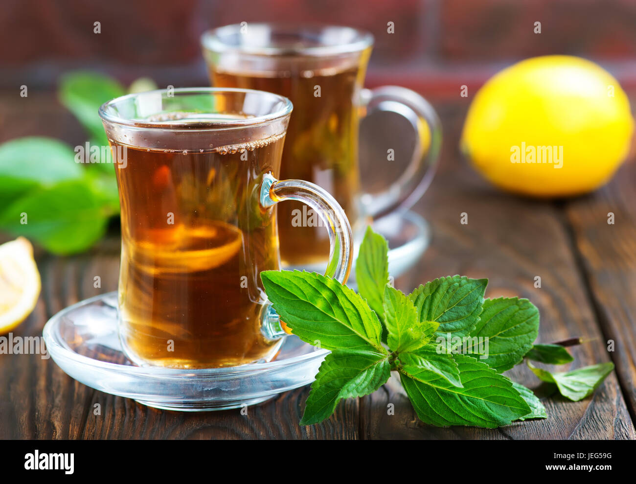 lemon tea in cup and on a table Stock Photo - Alamy