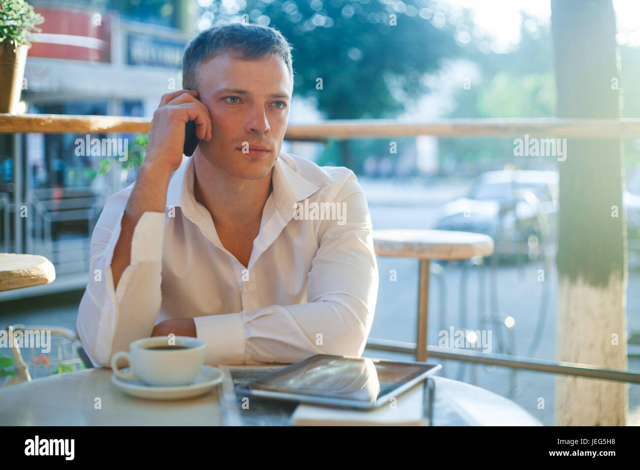 Attractive handsome man in cafe hi-res stock photography and images - Alamy