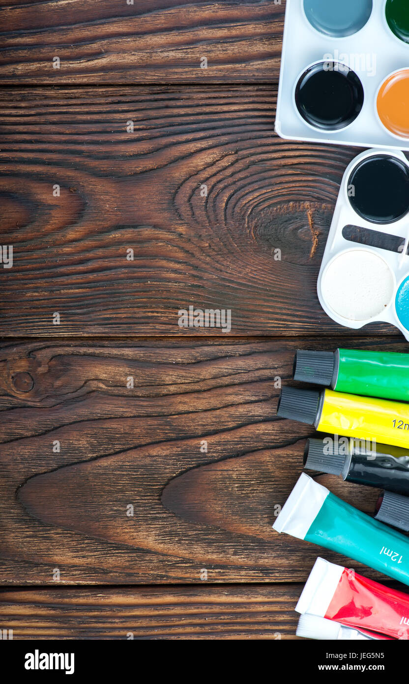 color paint and brushes on a table Stock Photo - Alamy