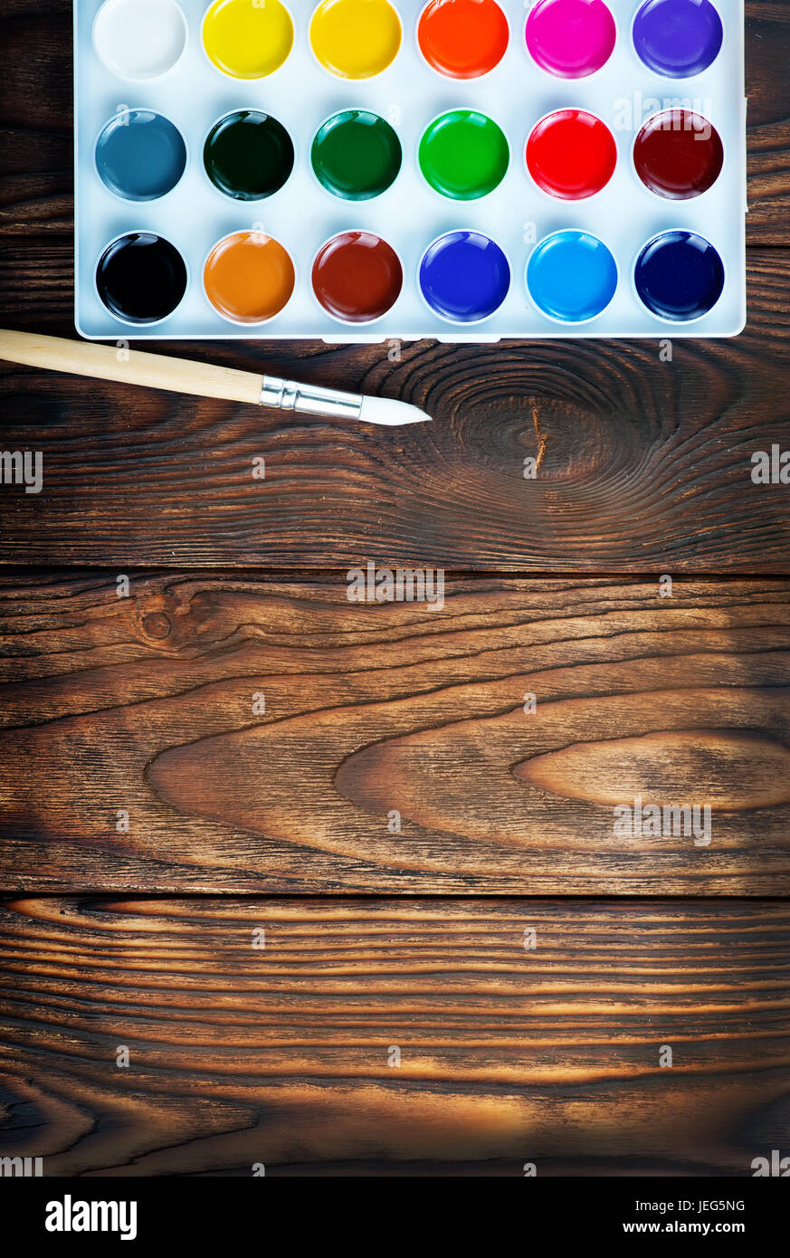 color paint and brushes on a table Stock Photo - Alamy