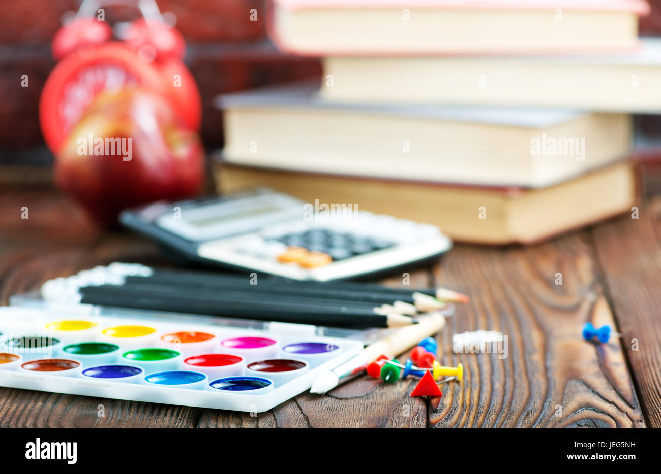 color paint and brushes on a table Stock Photo - Alamy